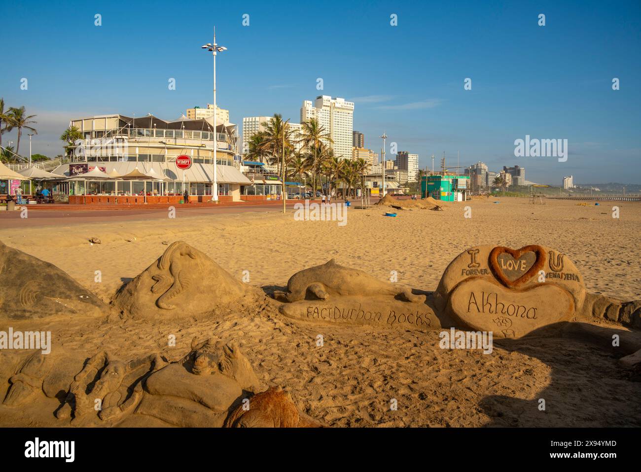View of promenade, beach and hotels from pier in Indian Ocean, Durban ...
