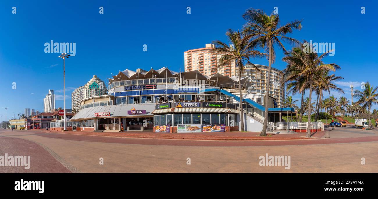 View of shops, restaurants and bars on promenade, Durban, KwaZulu-Natal ...