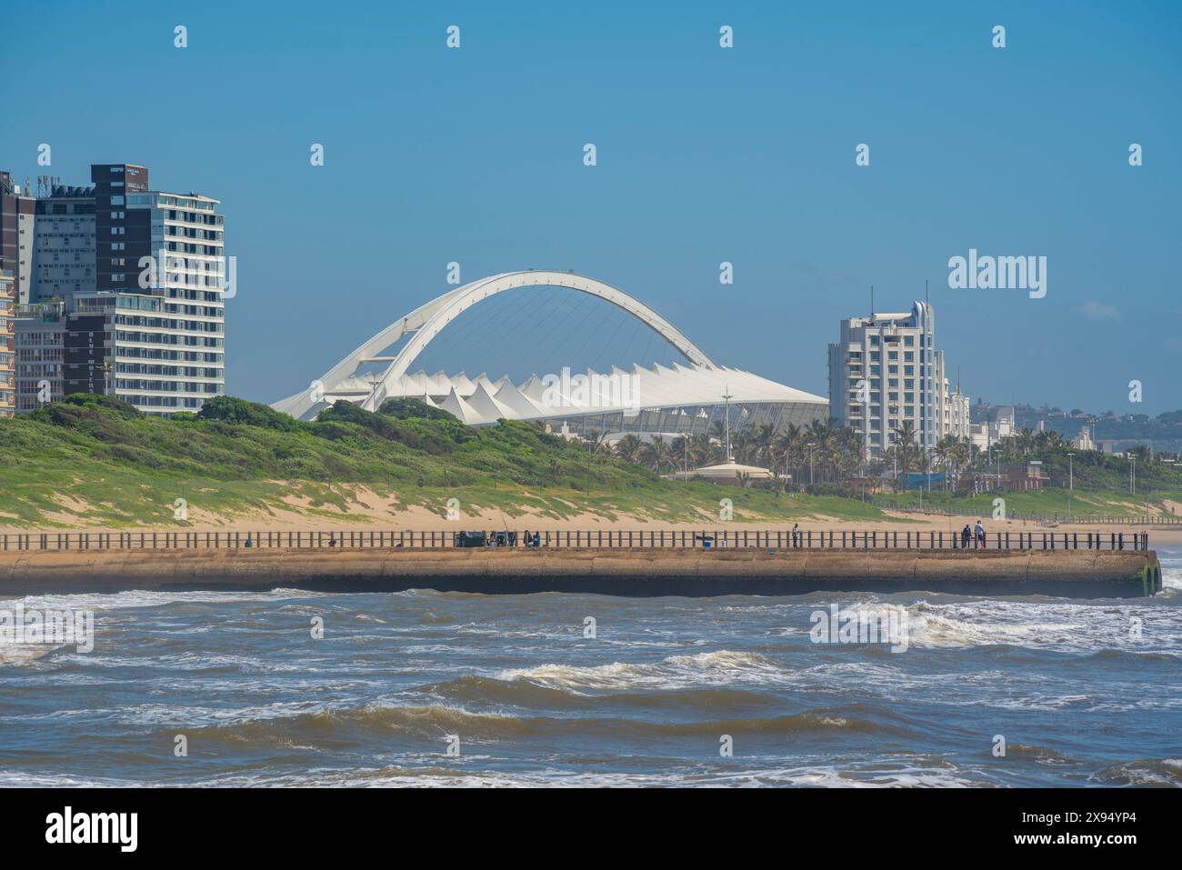 View of Moses Mabhida Stadium from pier in Indian Ocean, Durban ...