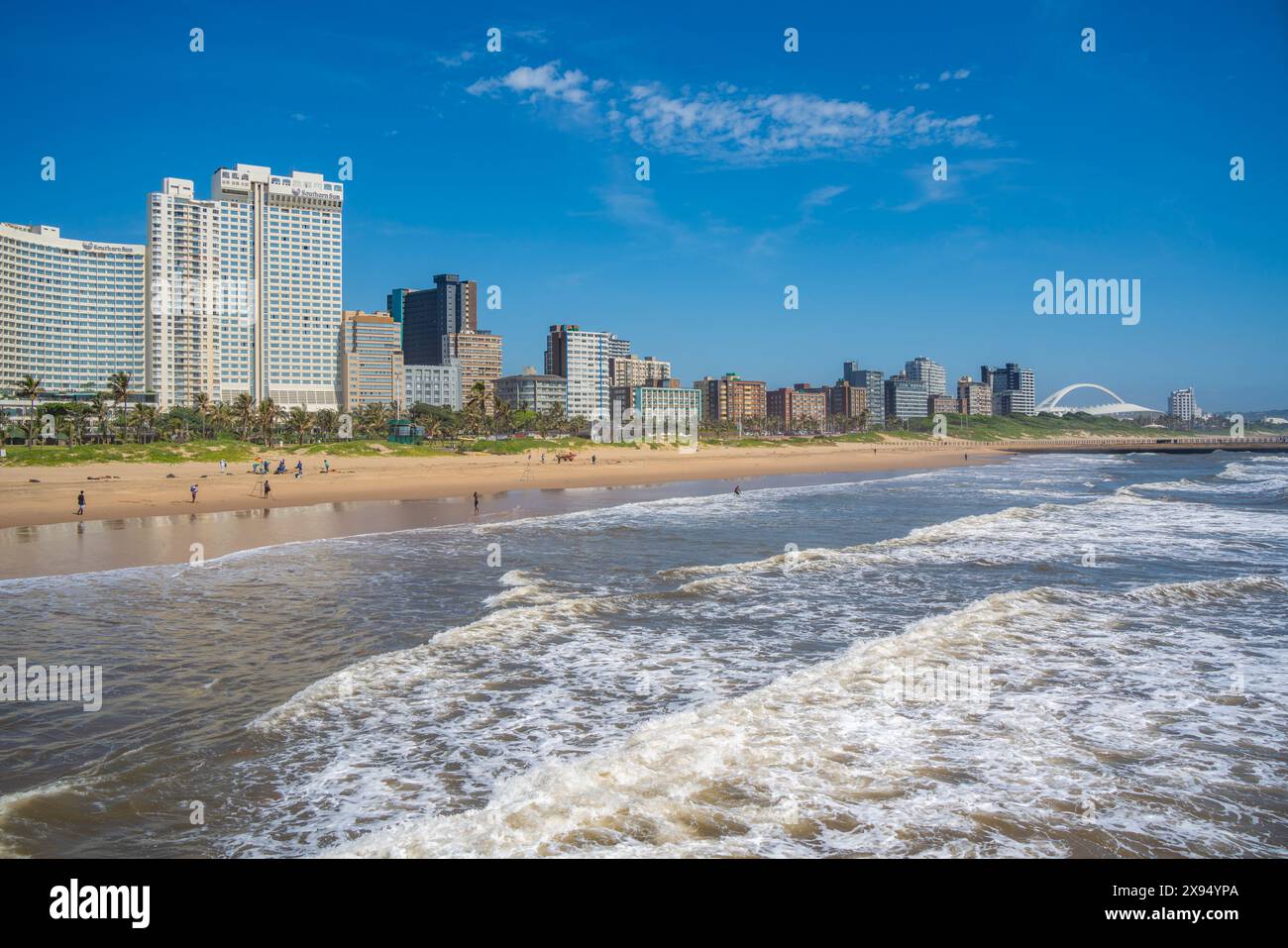 View of promenade, beach and hotels from pier in Indian Ocean, Durban ...