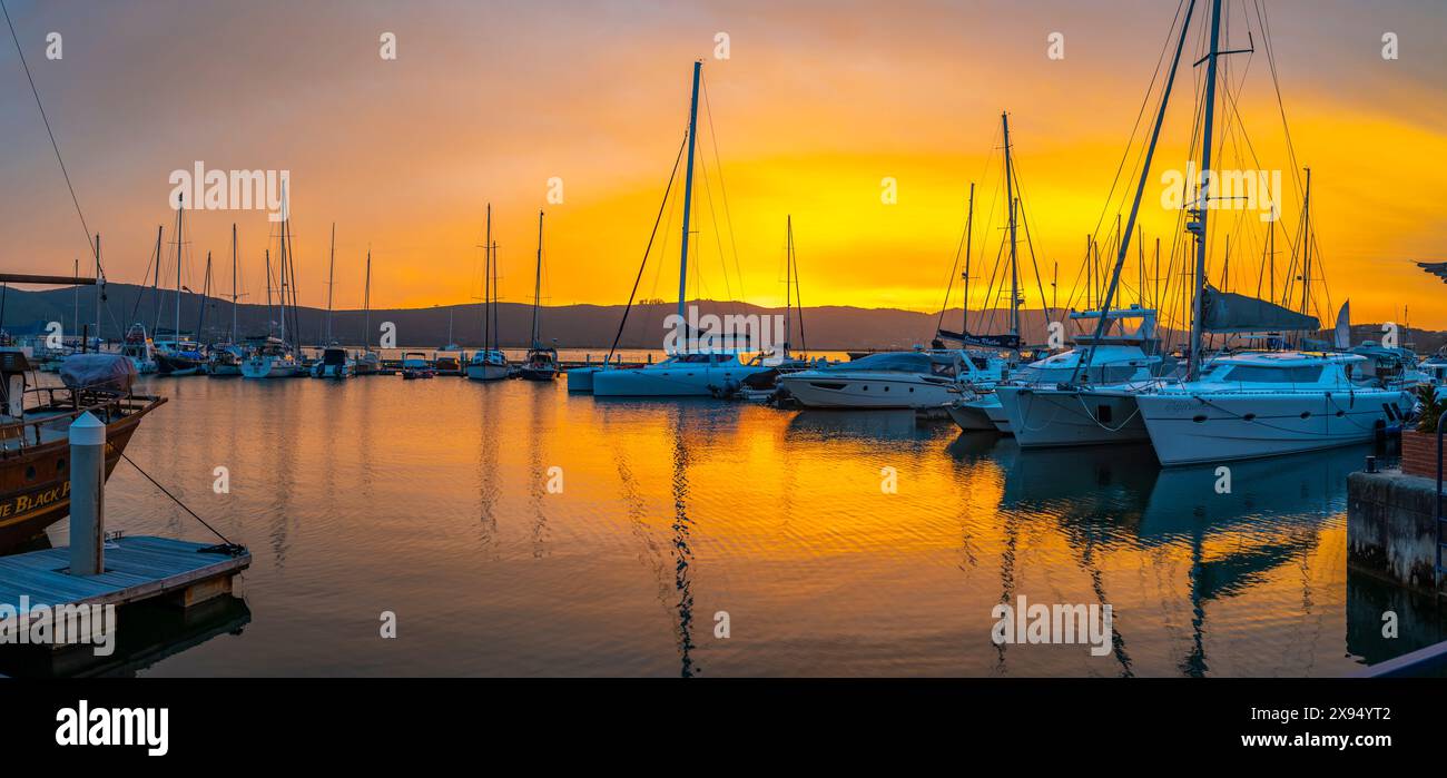 View of golden sunset and boats at Knysna Waterfront, Knysna, Western ...