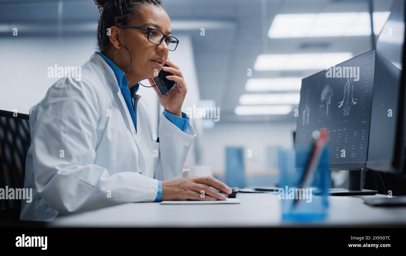 Medical Hospital Research Lab: Black Female Neurosurgeon Using Computer ...