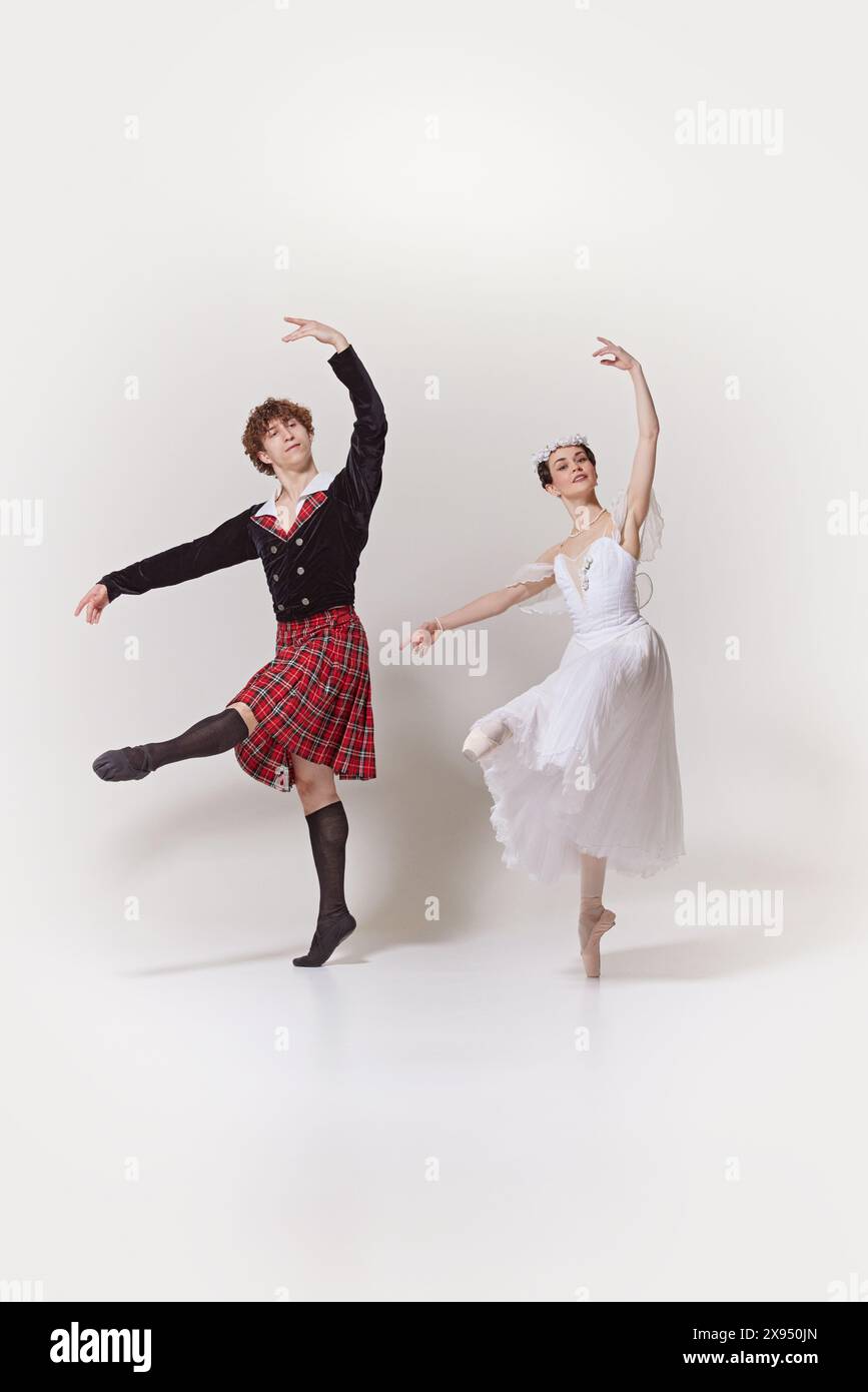 Ballerina in white dress and floral crown and her partner, in Scottish ...