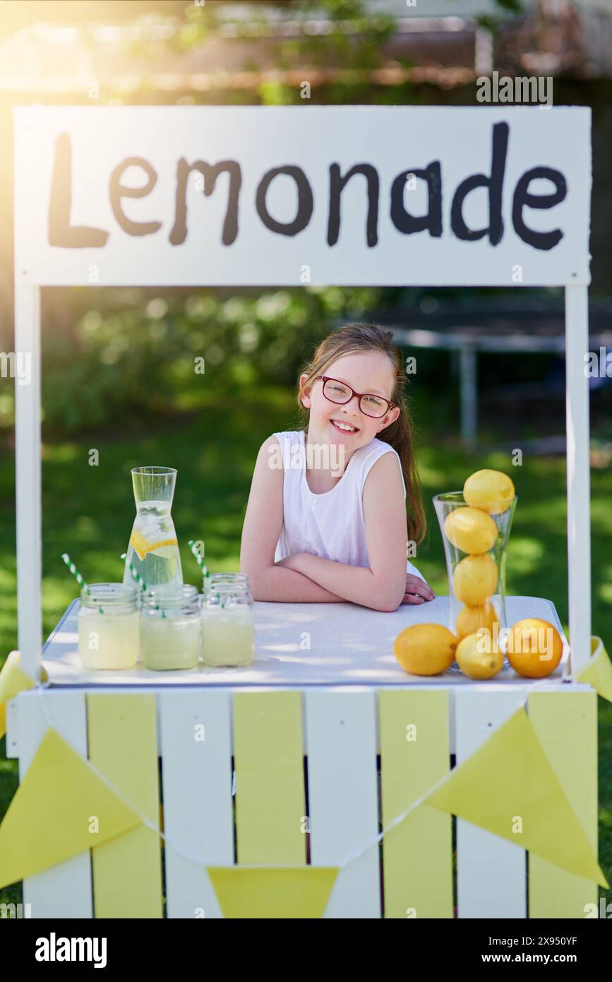 Children, portrait and girl with glasses at lemonade stand in garden ...