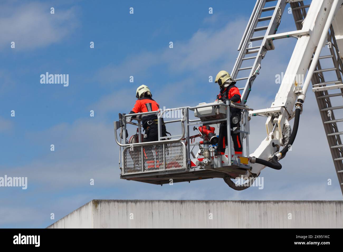 firefighters on a ladder in the middle of a rescue operation Stock ...