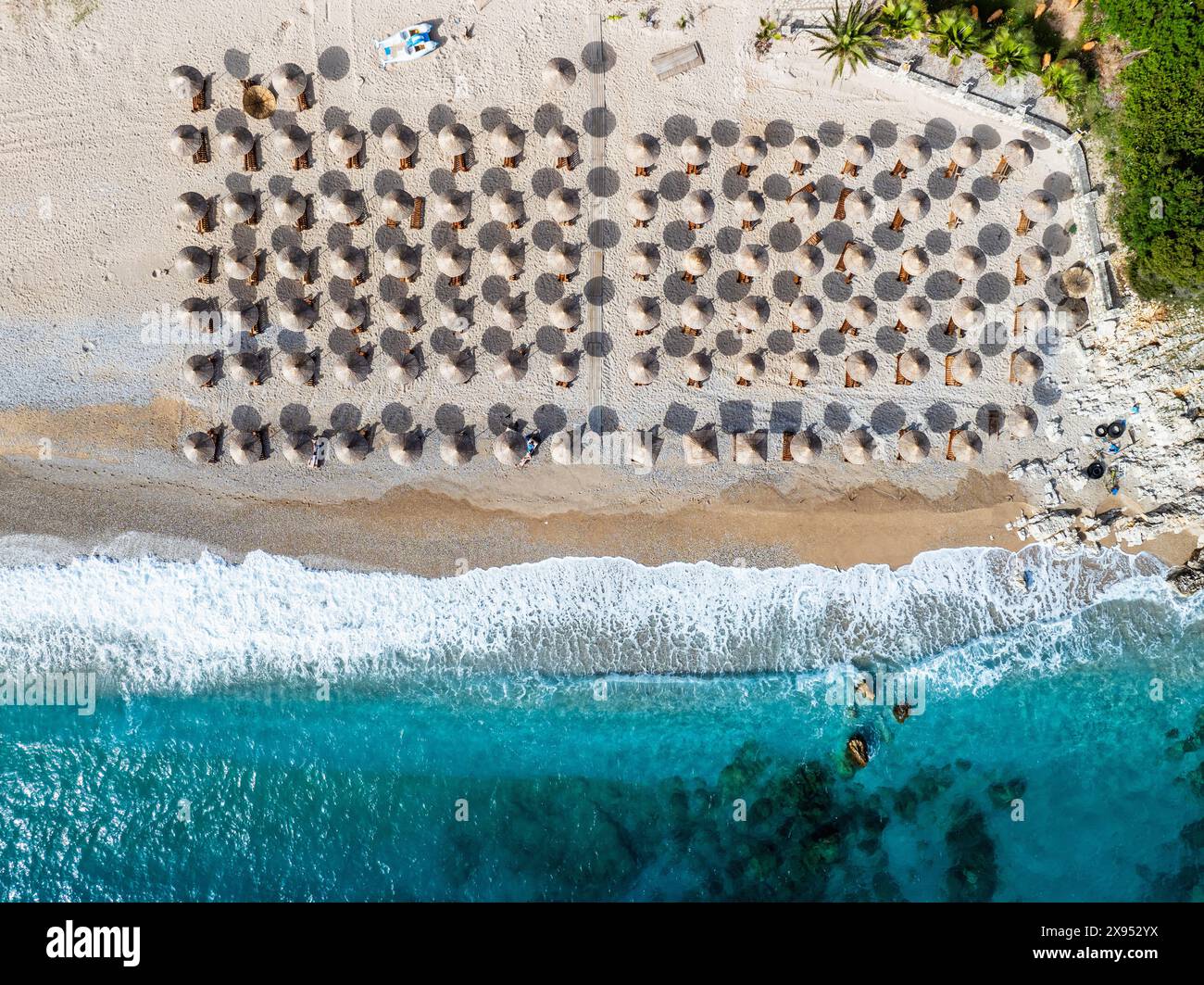 Top Down over Umbrellas and Beach in Himare from a drone, Albanian ...