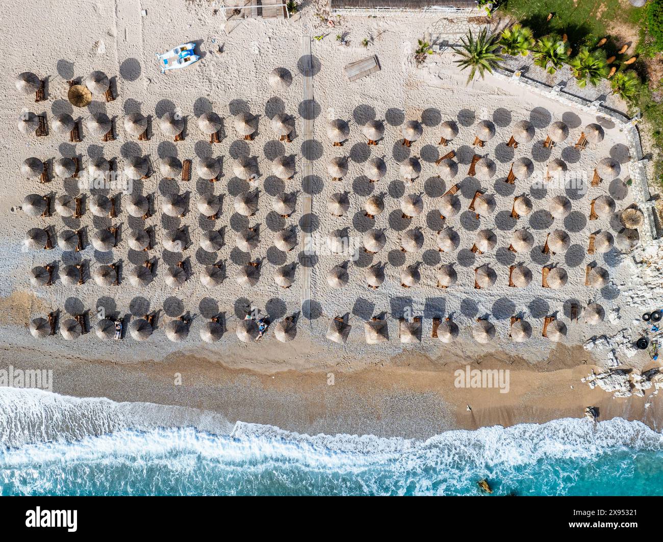 Top Down over Umbrellas and Beach in Himare from a drone, Albanian ...