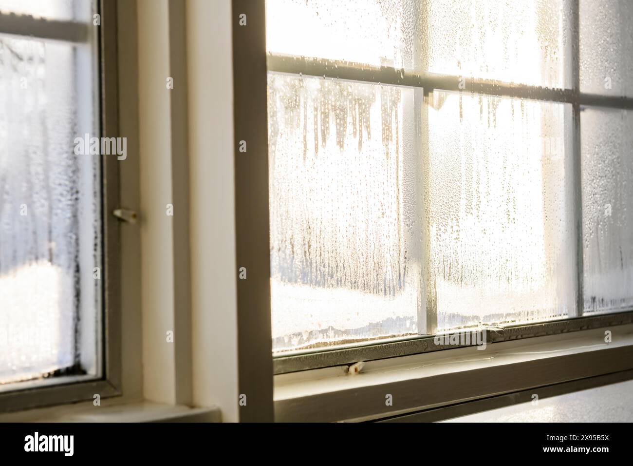 Drops of condensation on the metal-plastic window. Fragment of a ...