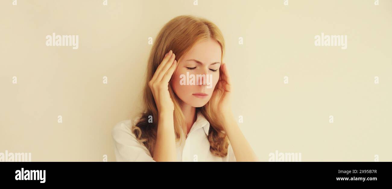 Exhausted tired caucasian young woman employee with headache, stress ...