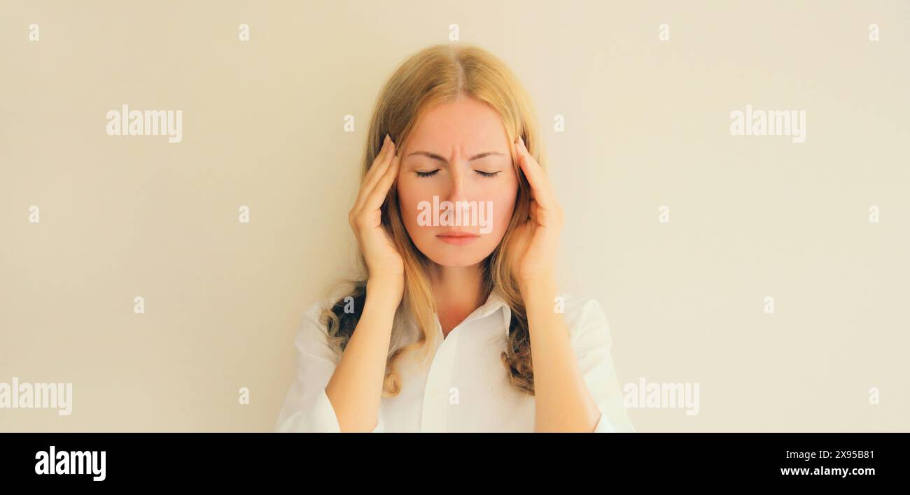 Exhausted tired caucasian young woman employee with headache, stress ...