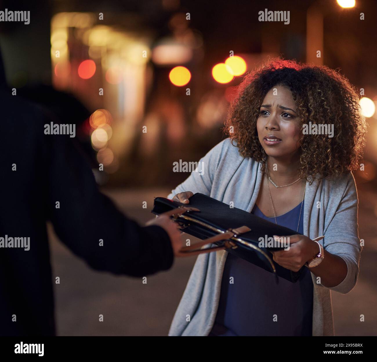 Thief, handbag and scared woman in city with crime, force and stealing ...