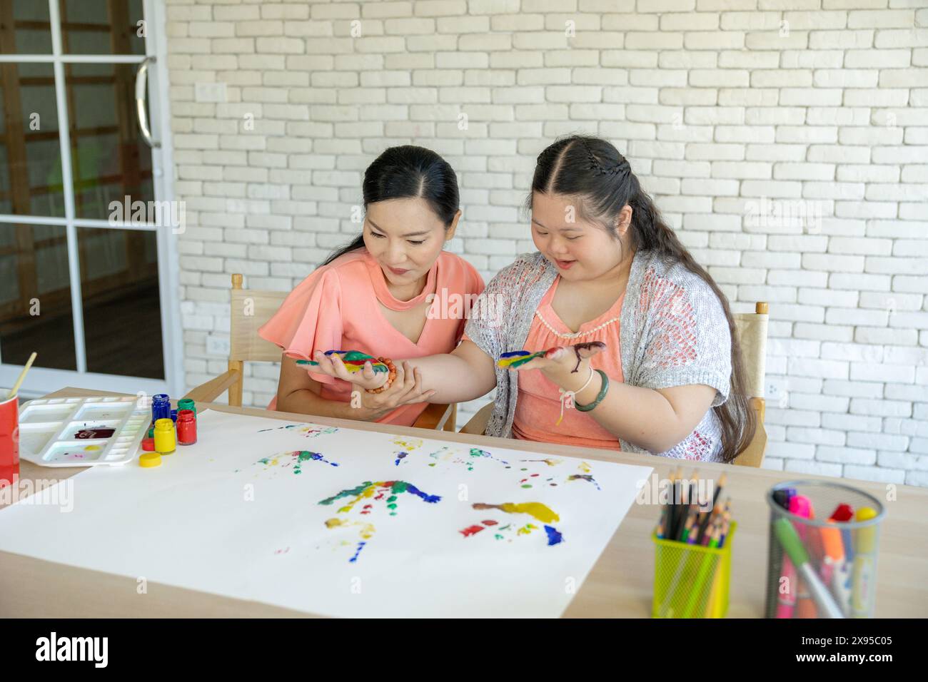 Mother and child are doing art activities together at home Stock Photo ...