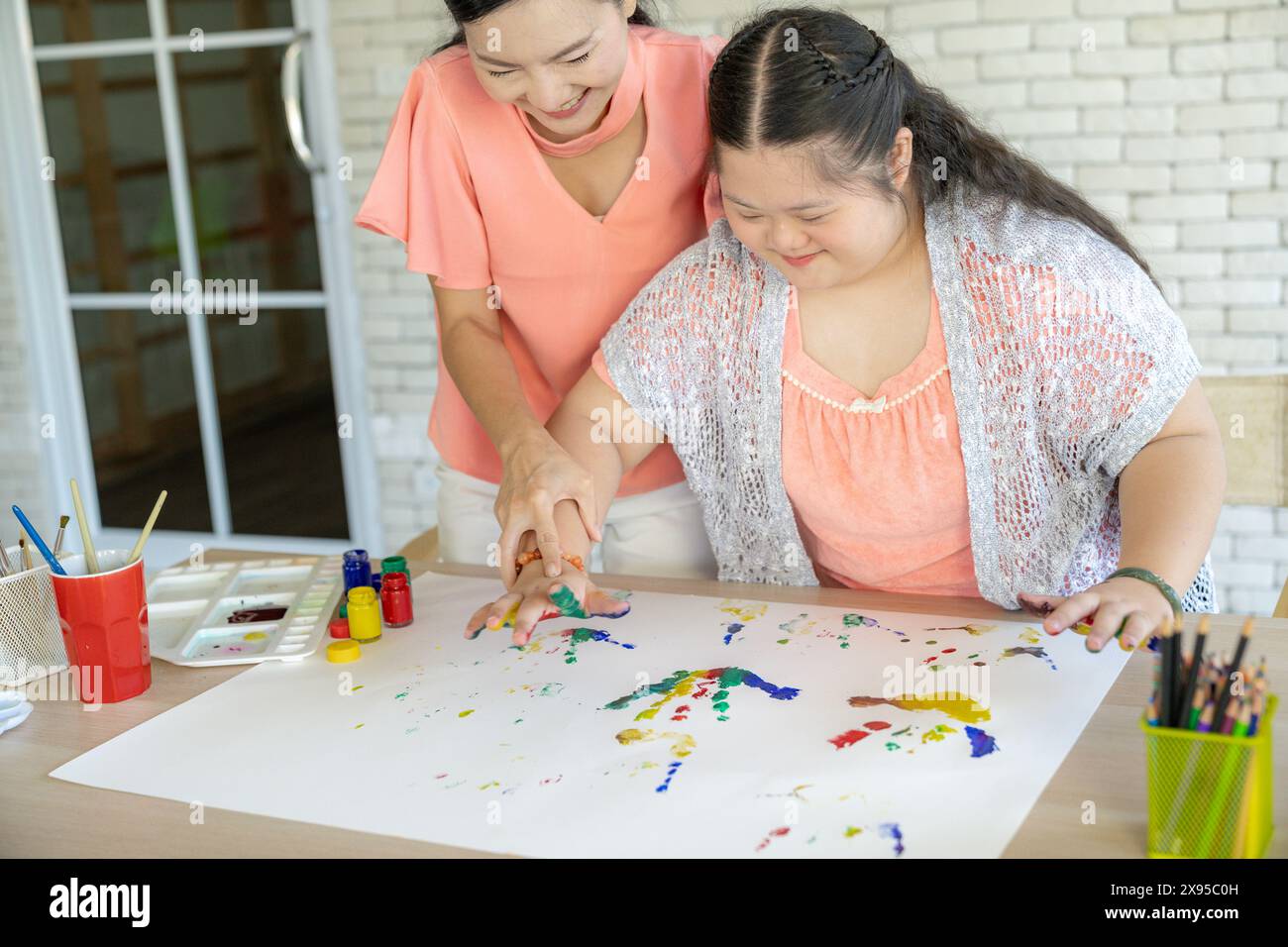 Mother and child are doing art activities together at home Stock Photo ...