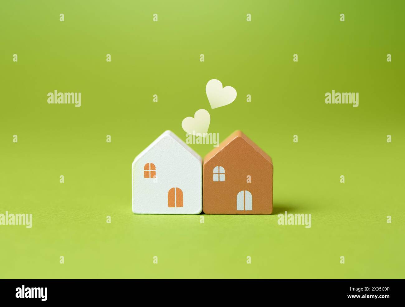 Two houses and hearts. Love and relationships concept. Purchase joint ...