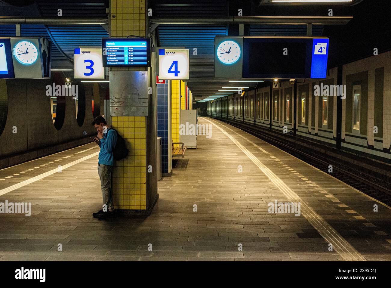 Passenger & Commuter Waiting for Train Passenger & Commuter Waiting for ...