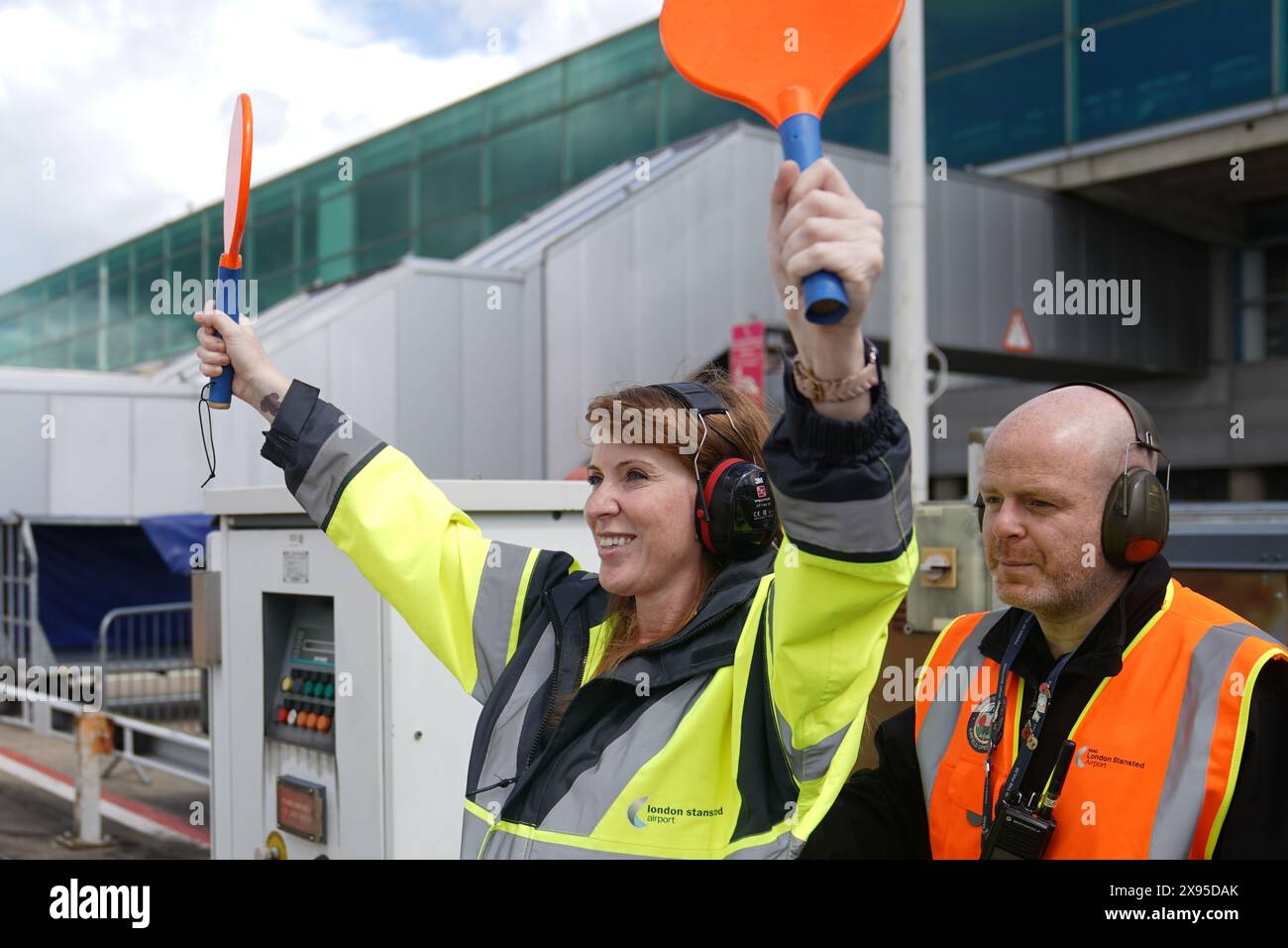 Labour Party deputy leader Angela Rayner marshals an easyJet plane ...