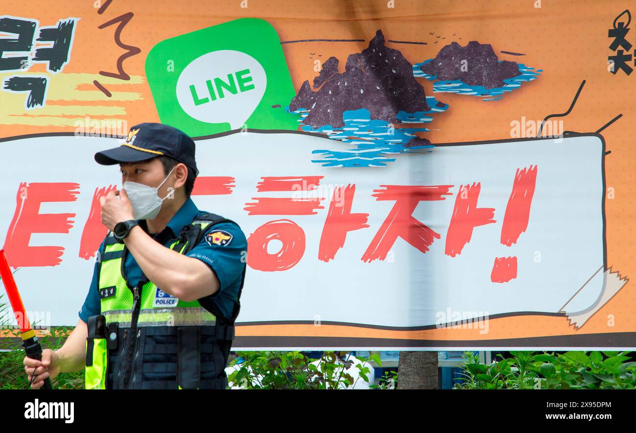 Line messenger app, May 25, 2024 : A policeman stands guard in front of ...