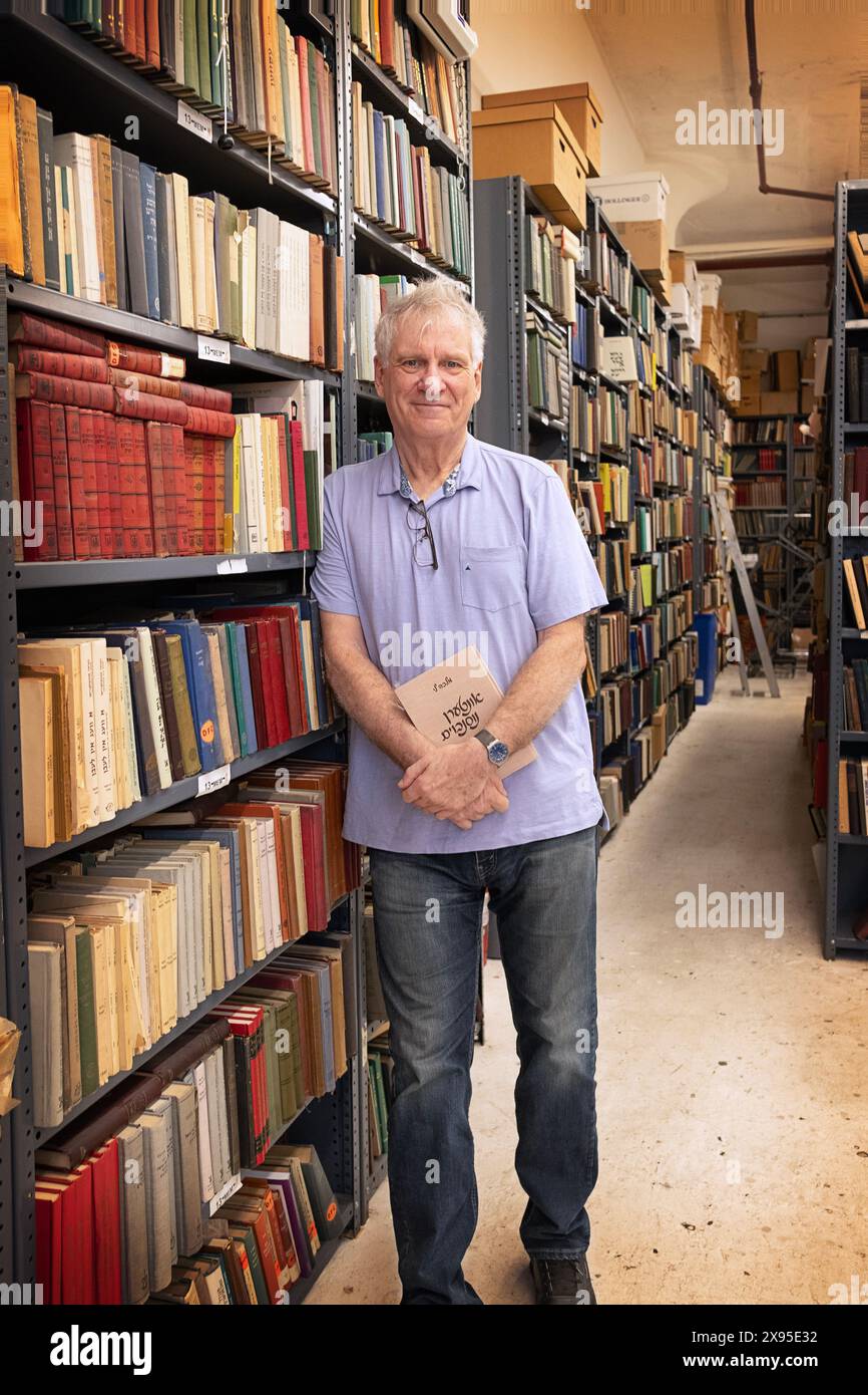 A posed portrait of Hy Wolf, executive Director of CYCO, a Yiddish book ...