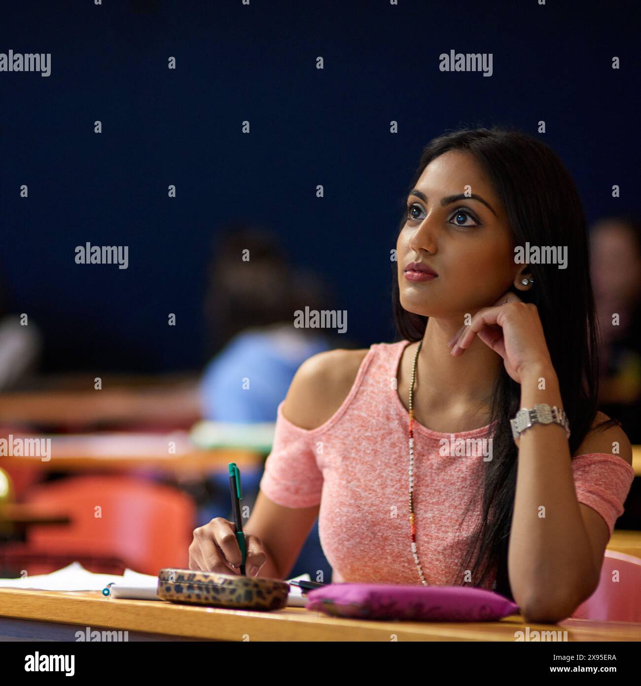 Woman, college and student with thinking in lecture hall for lesson ...