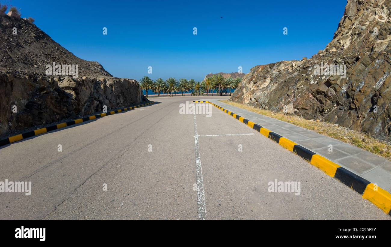 Photography of road in mountains leading to public park in Oman, Muscat ...