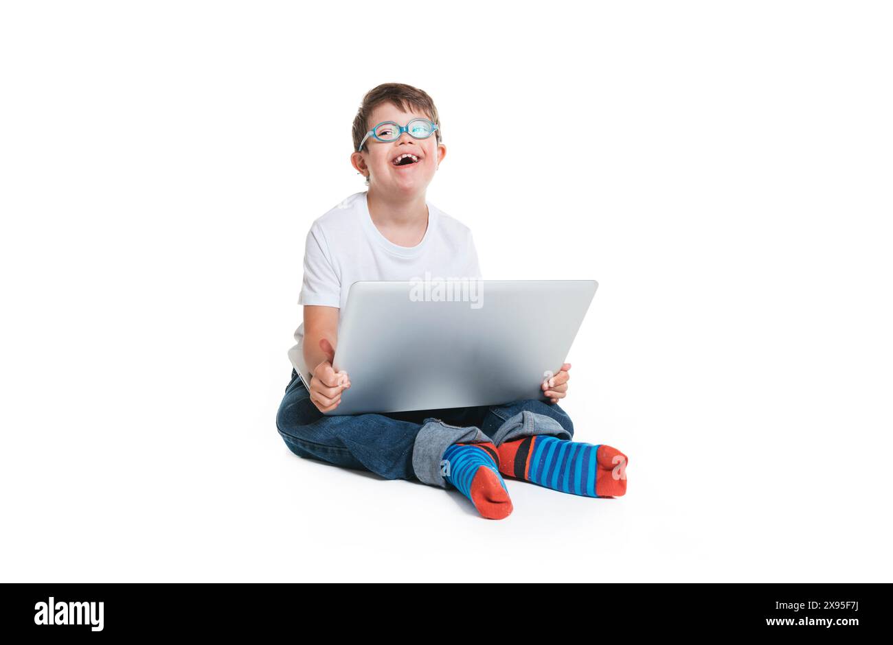 child boy posing on studio white background with laptop Stock Photo - Alamy