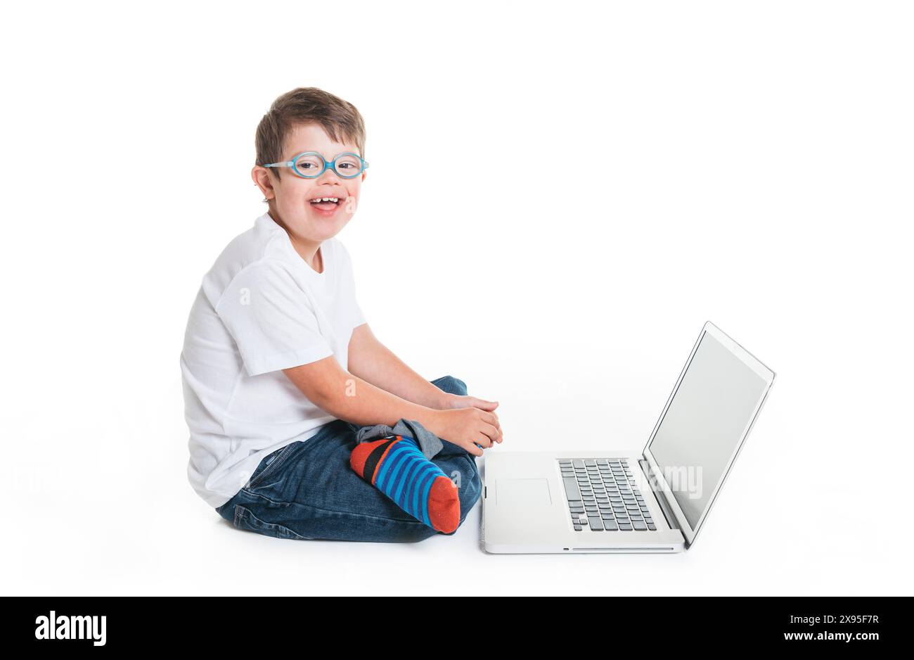 child boy posing on studio white background with laptop Stock Photo - Alamy