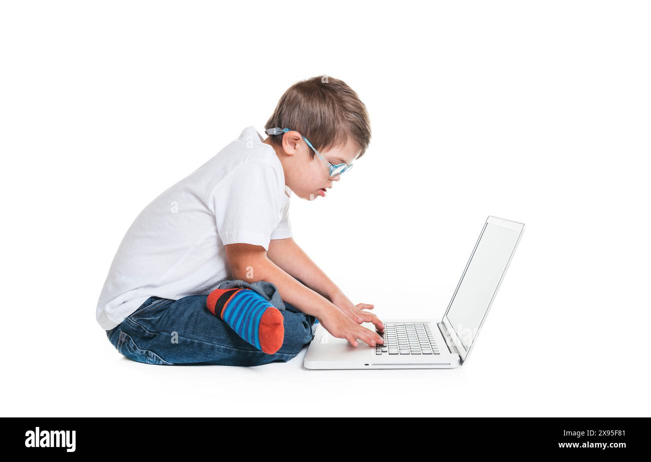 child boy posing on studio white background with laptop Stock Photo - Alamy