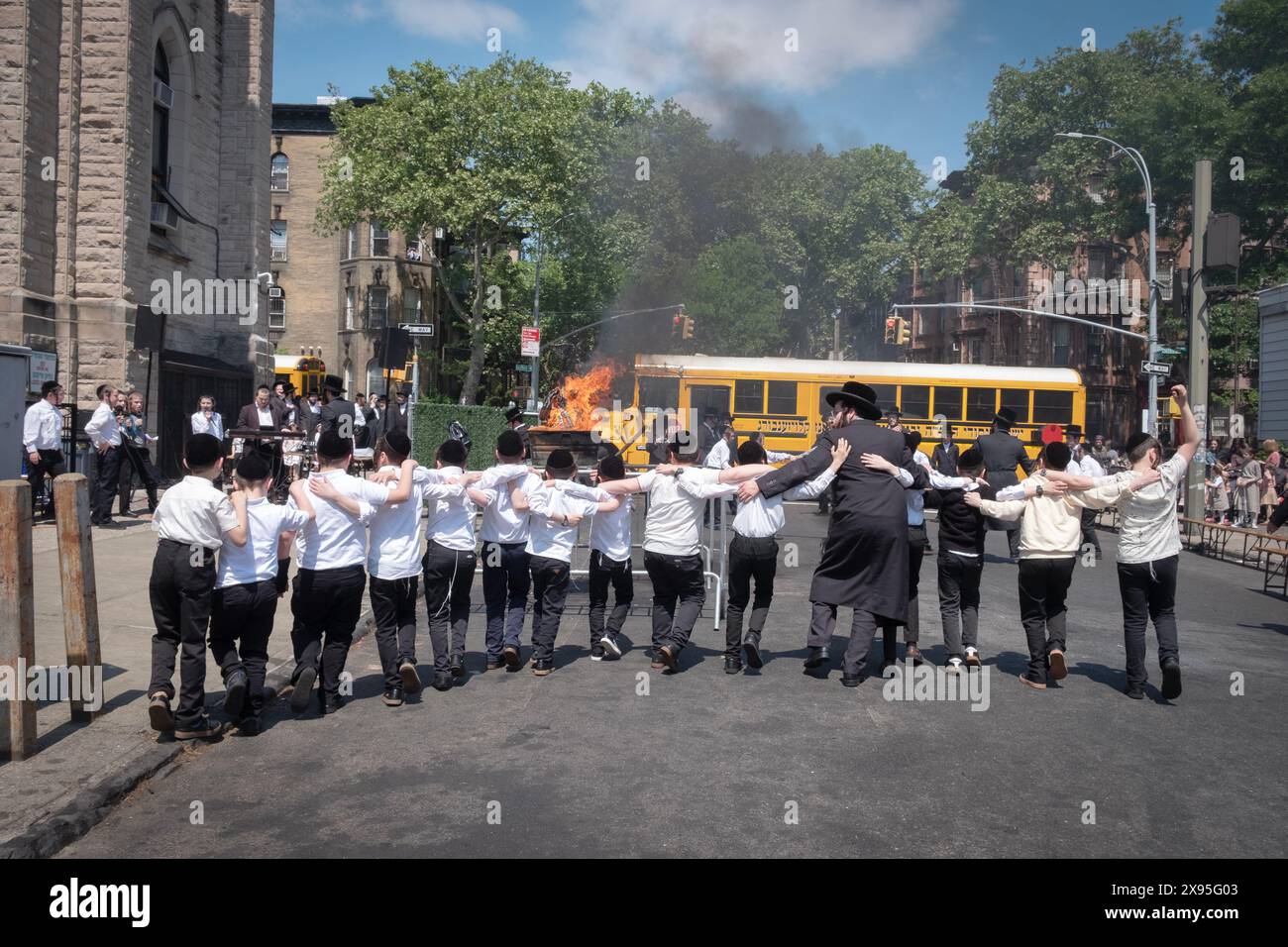 During Lag Bomer 2024 celebrations, a rabbi & his students line dance towards the traditional ...