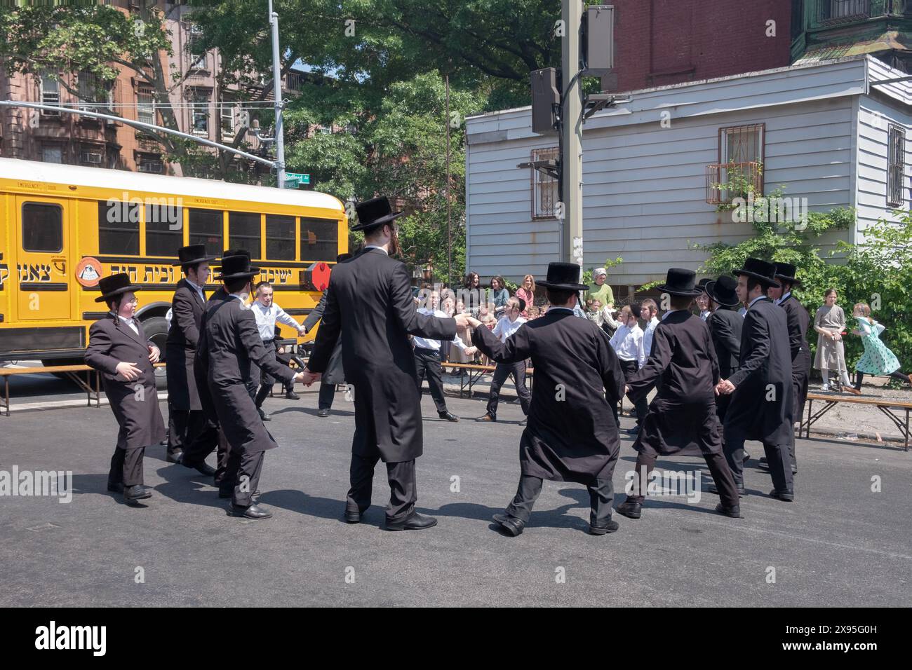 Hasidic teachers and older students dance celebrate the Lag B'Omer ...