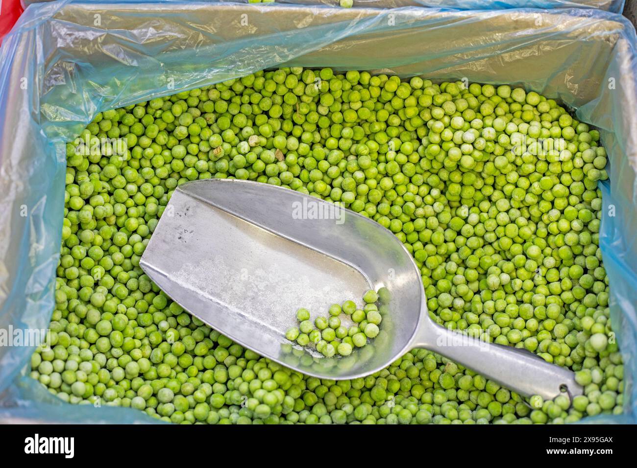 frozen young green peas by weight in the supermarket. Vitamins and ...