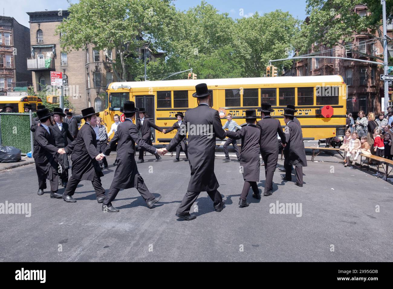 Hasidic teachers and older students dance celebrate the Lag B'Omer ...