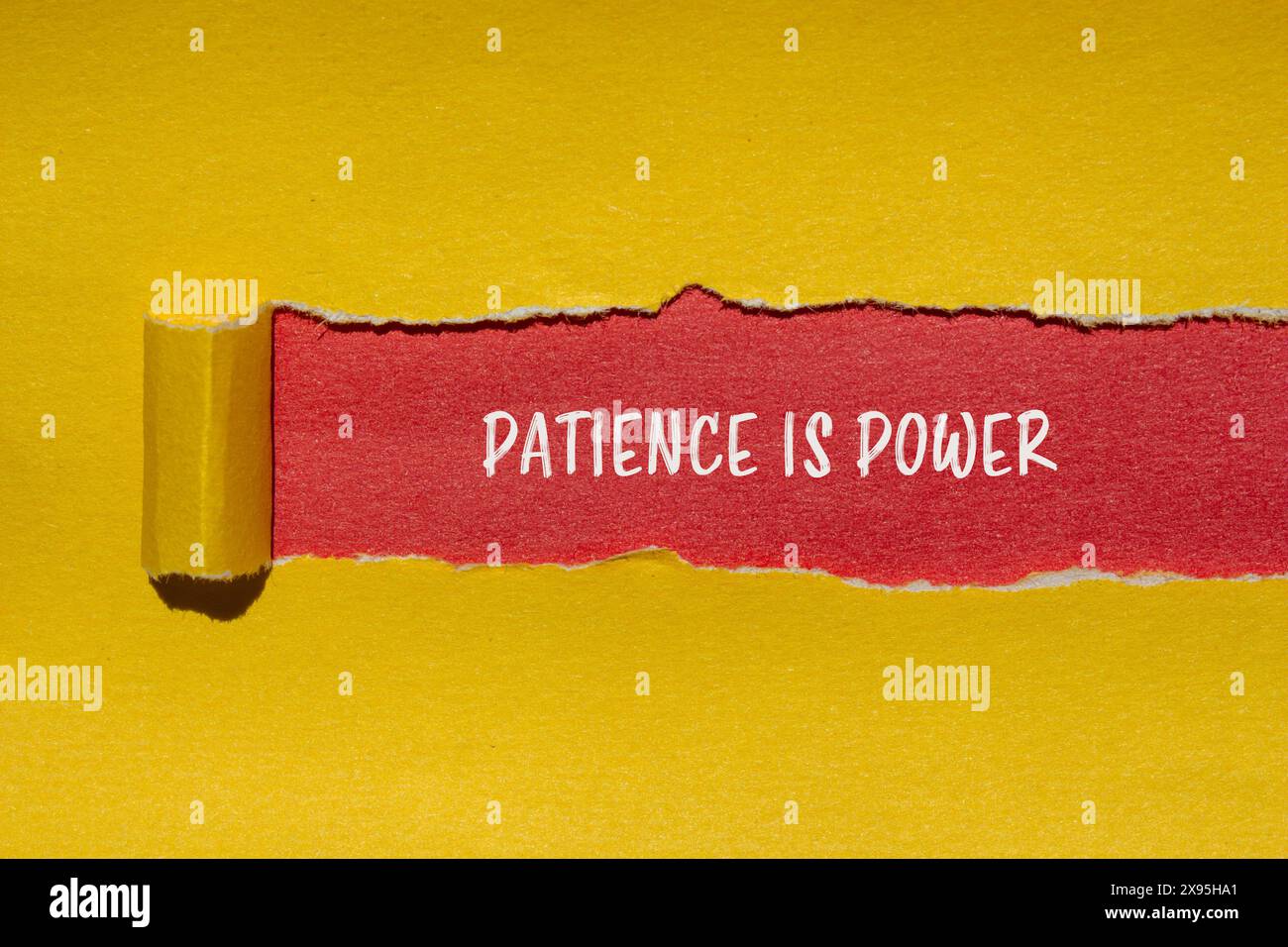 Patience is power words written on ripped yellow paper with red ...