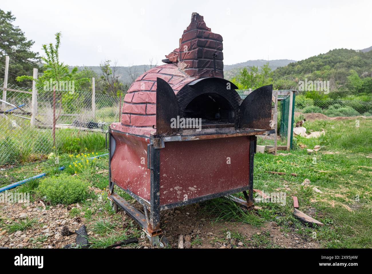 An old oven for baking bread. Baking buns in a traditional old oven ...