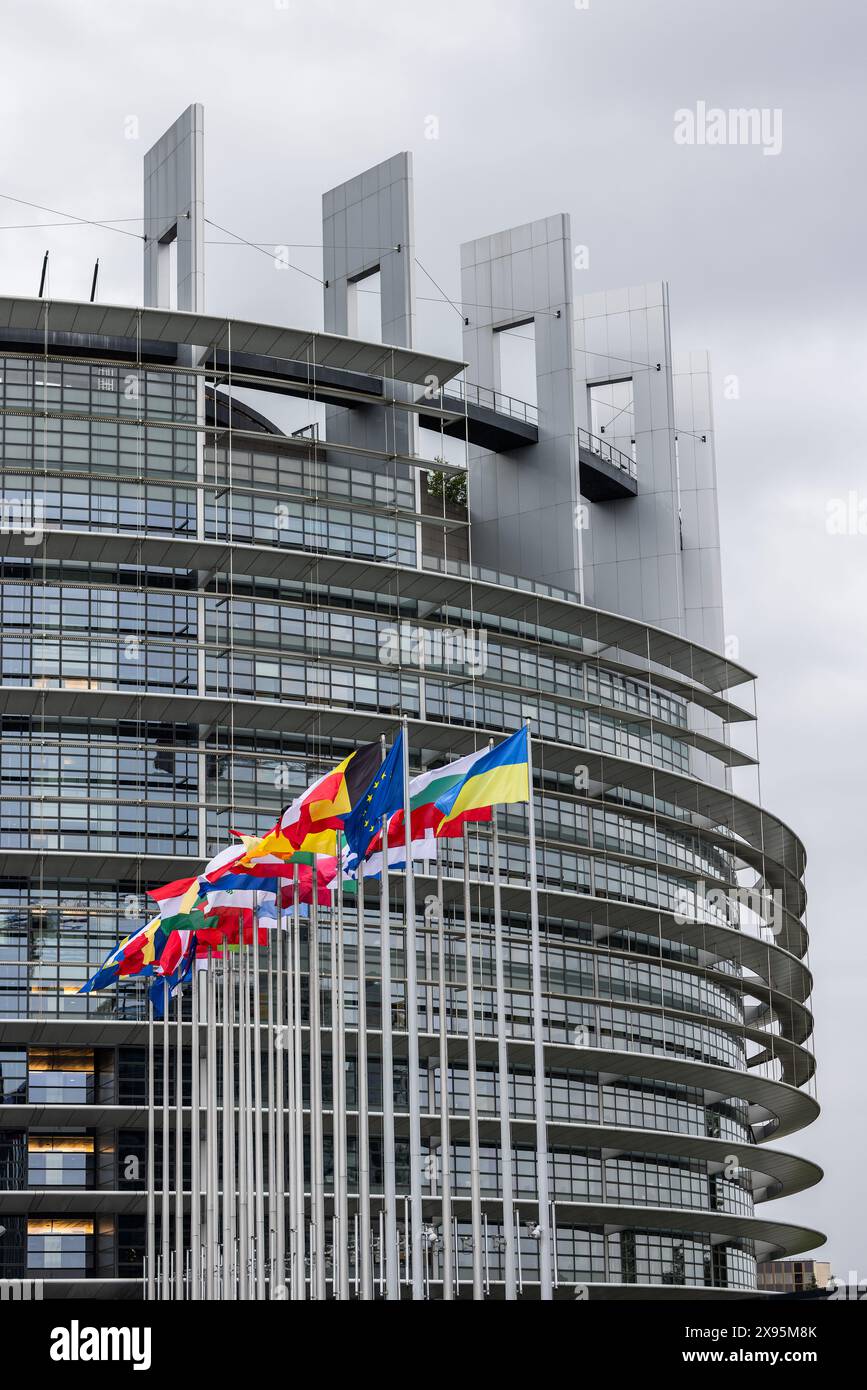 29 May 2024, France, Straßburg: The flags of the European Union, its ...