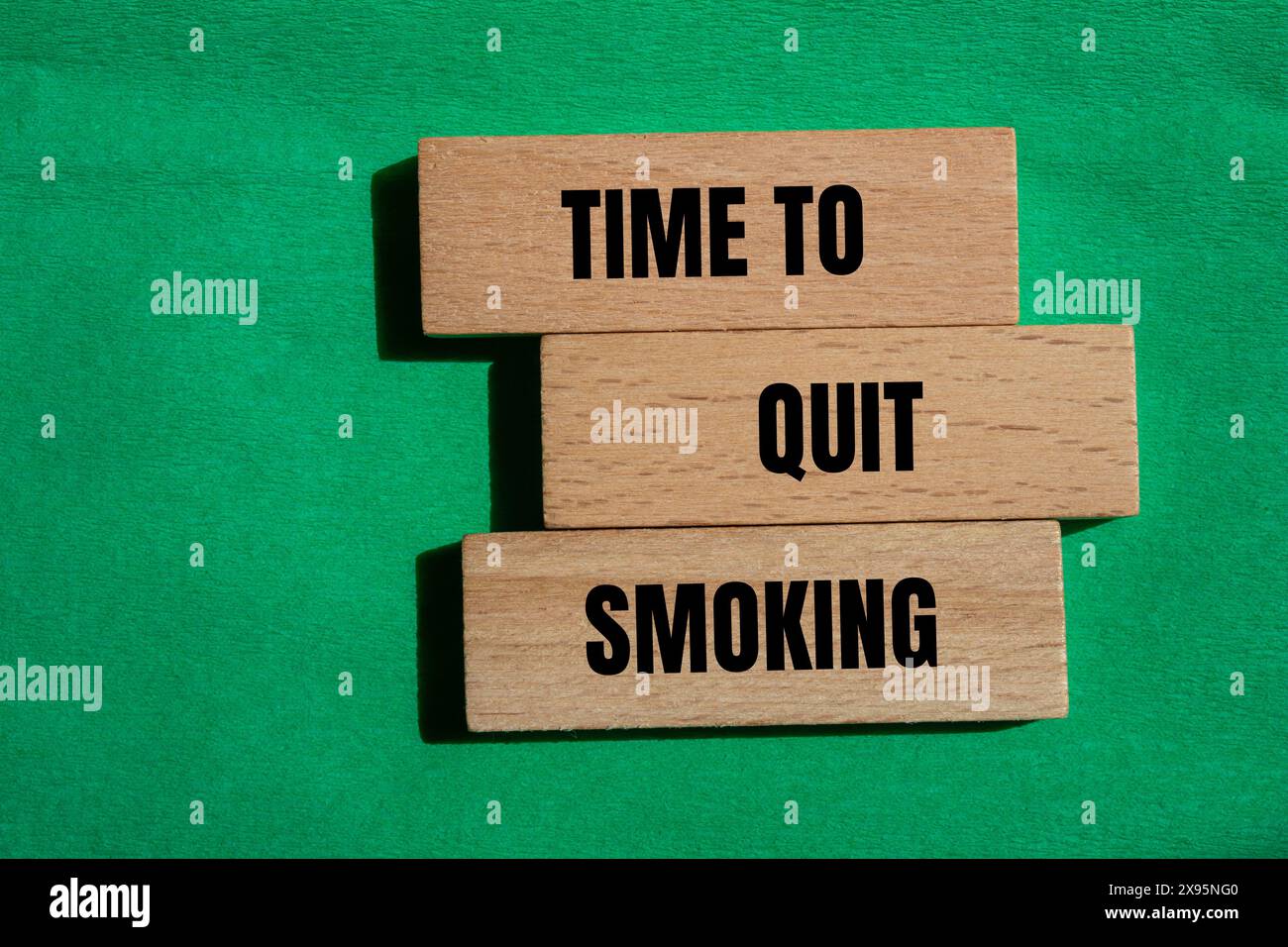 Time to quit smoking words written on wooden blocks with green ...