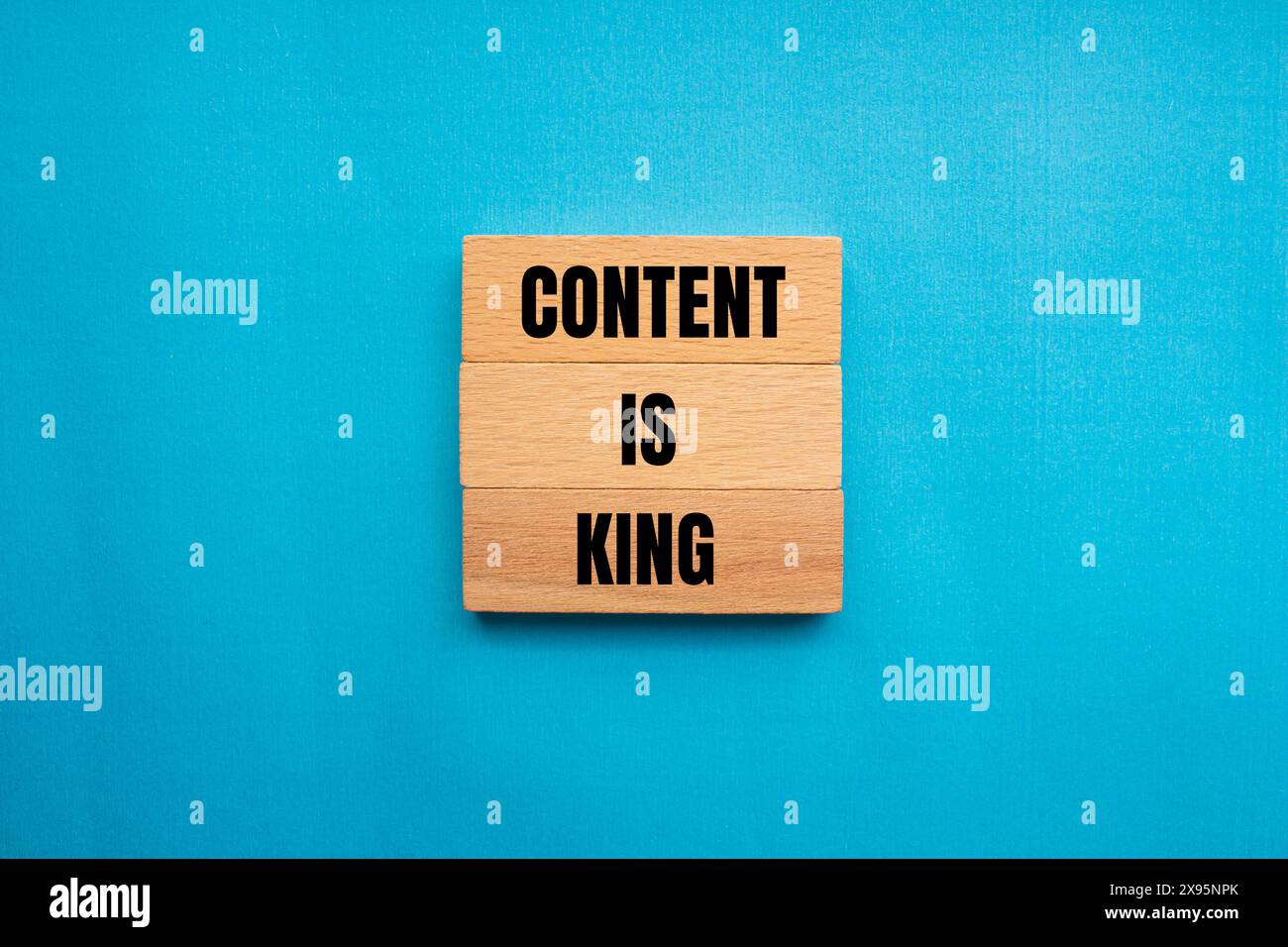 Content is king words written on wooden blocks with blue background ...