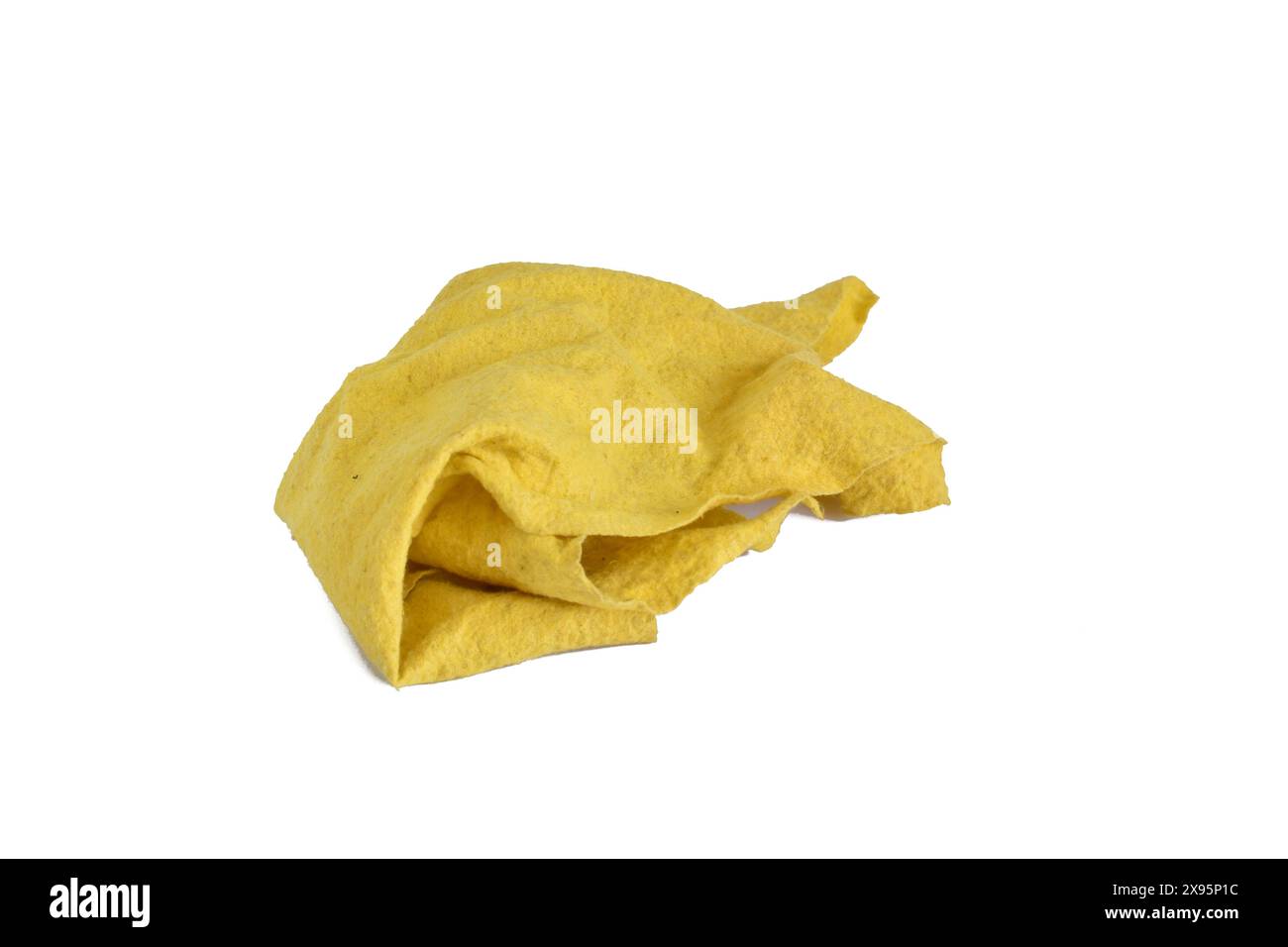A dirty used yellow rag lies on a white background Stock Photo - Alamy