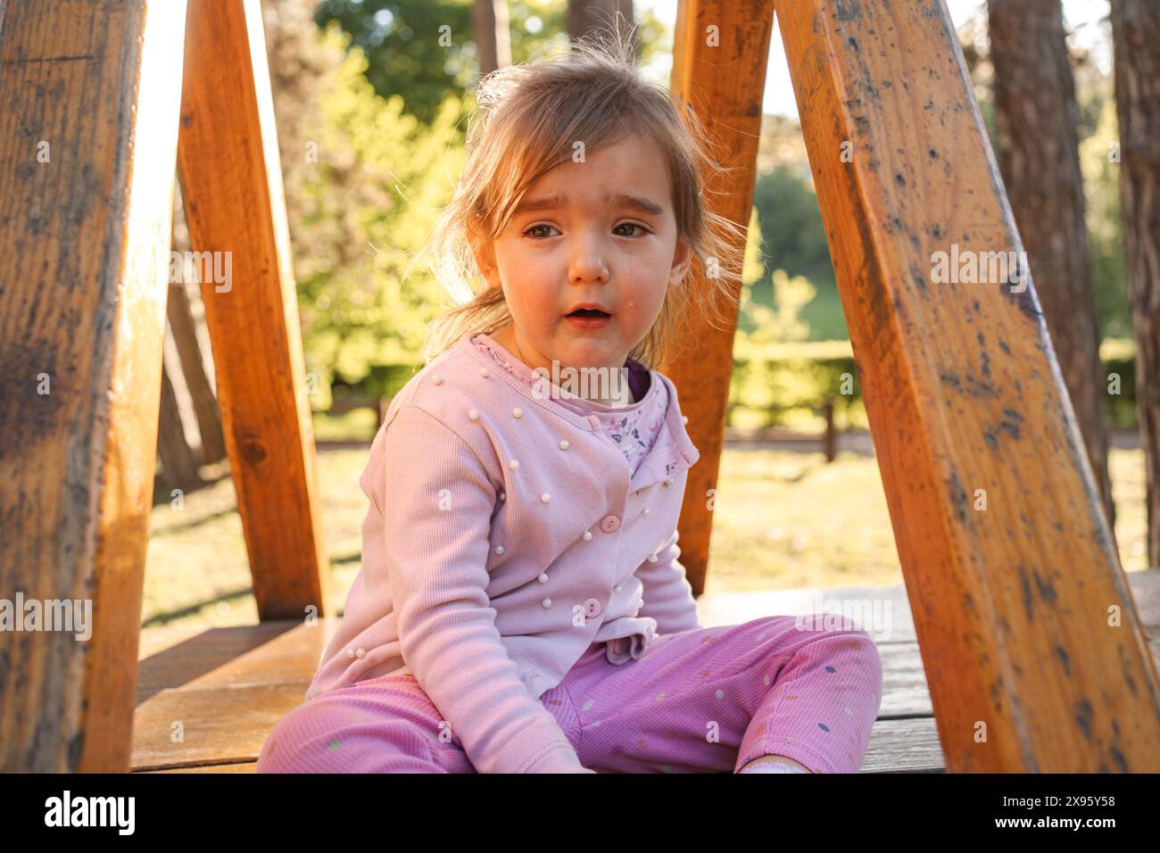 Little girl crying on the playground in the playground Stock Photo - Alamy