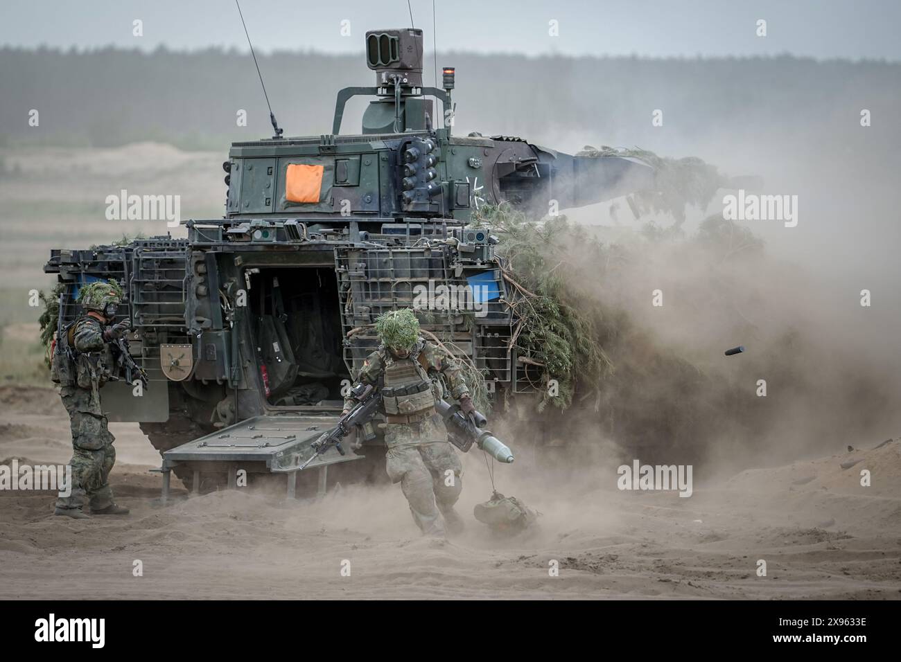 Pabrade, Lithuania. 29th May, 2024. Bundeswehr soldiers jump out of a ...