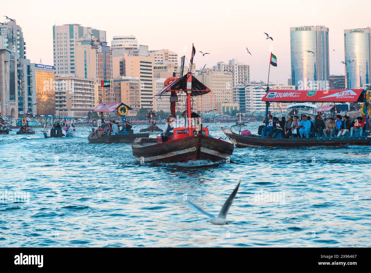 Dubai, UAE - January 6, 2024: Traditional boats against a backdrop of ...