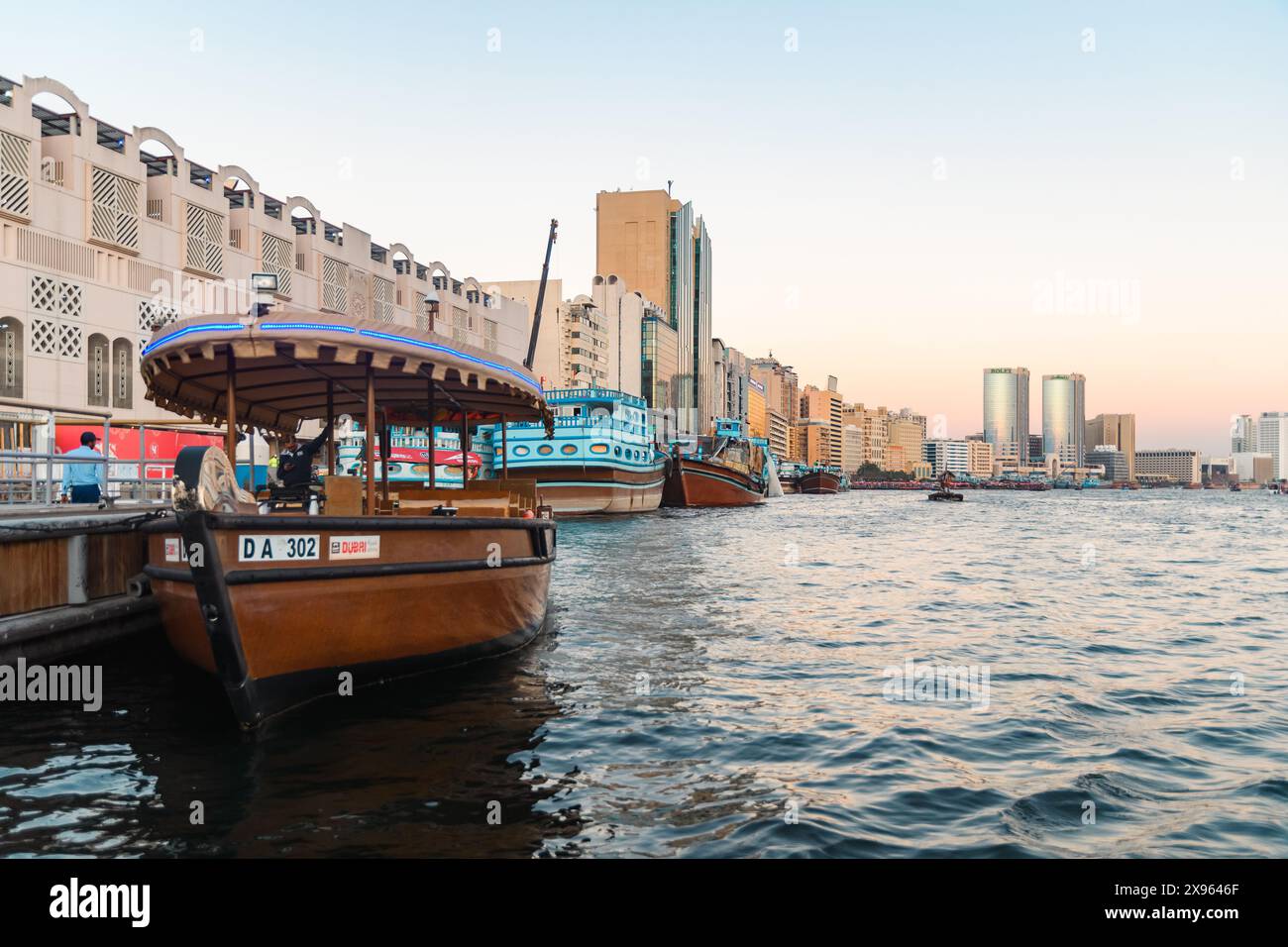 Dubai, UAE - January 6, 2024: Abras glide on Dubai Creek as the city ...