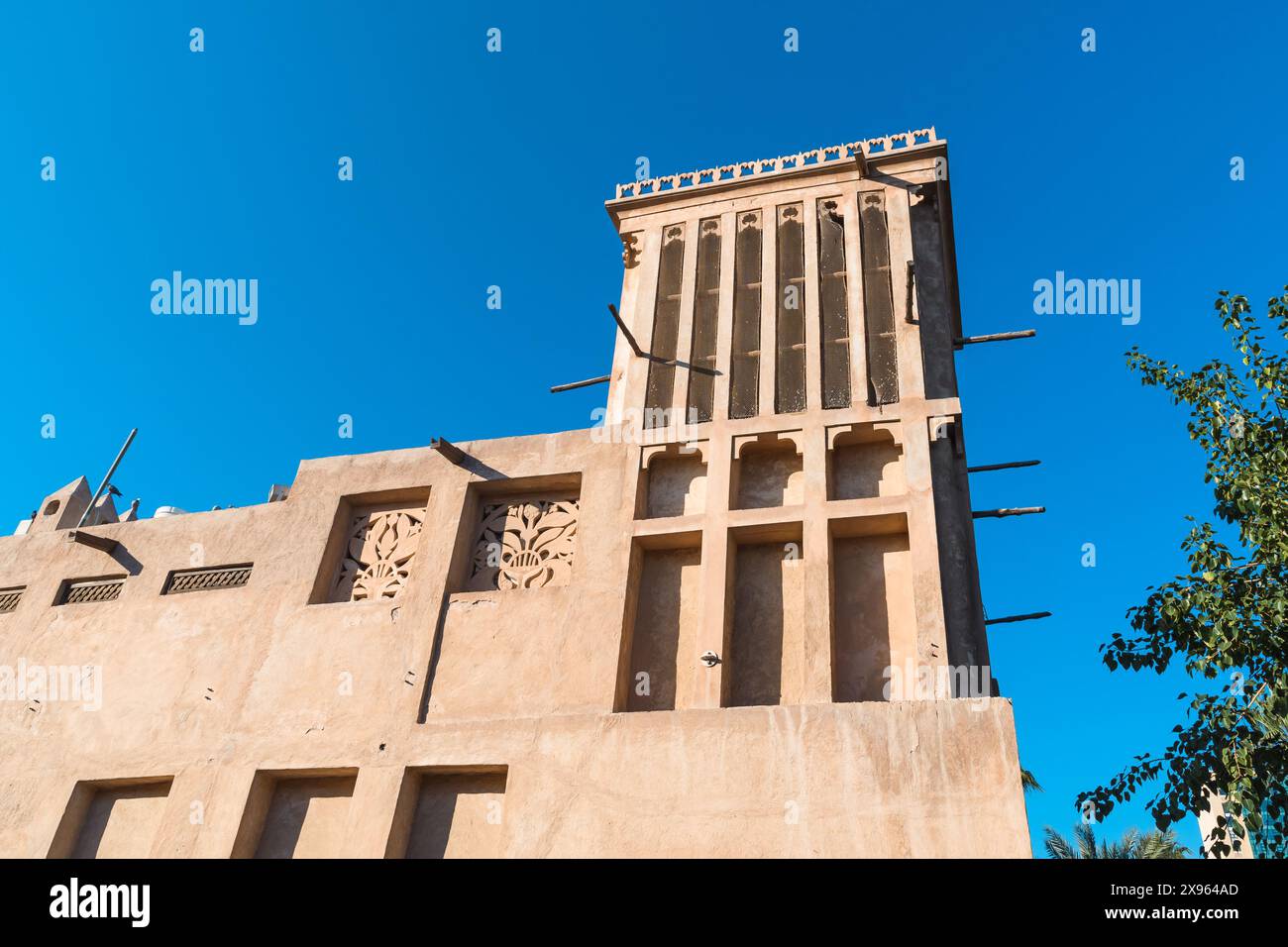 Dubai, UAE - January 6, 2024: Traditional wind towers and architecture ...