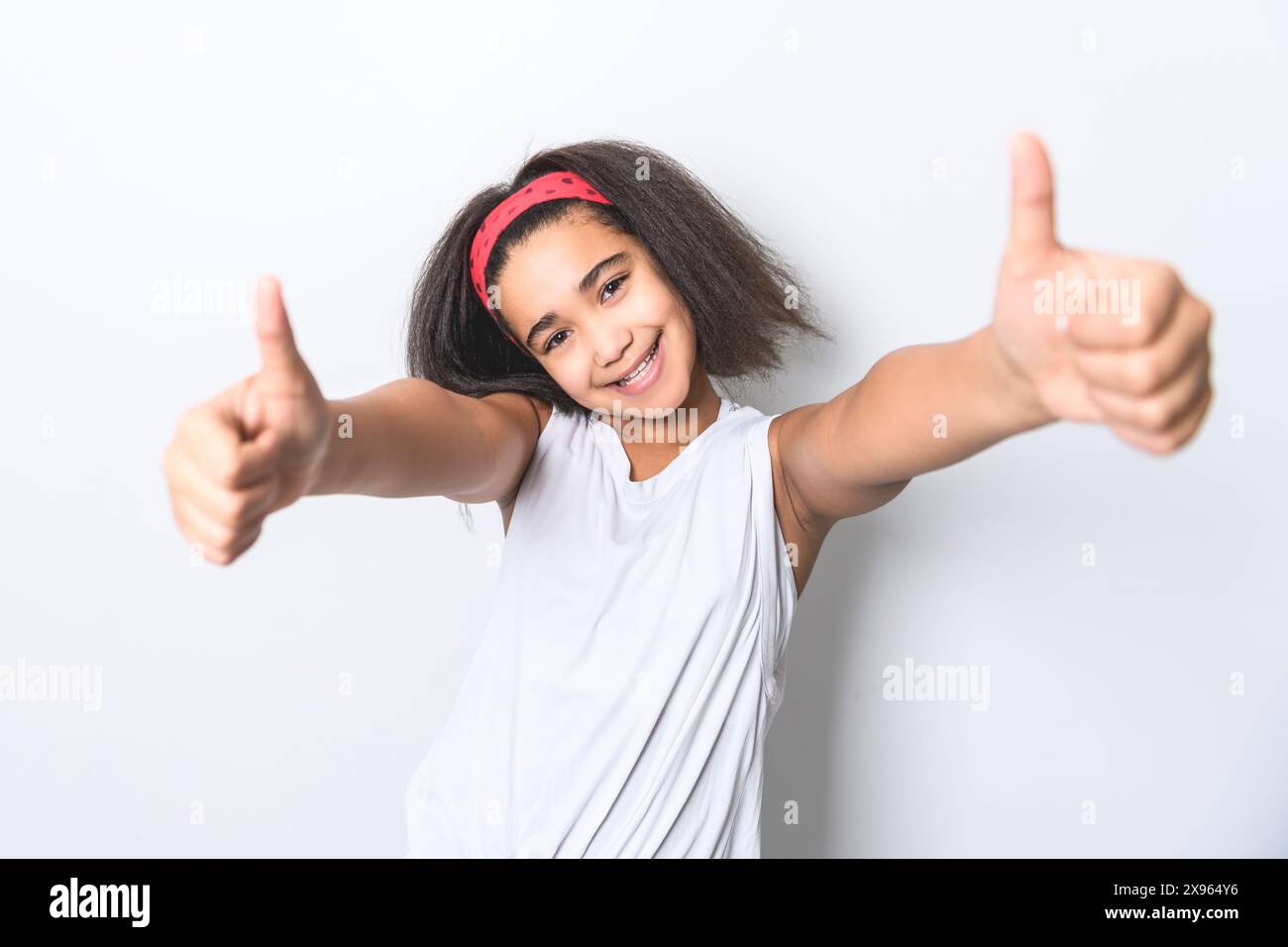 Adorable 9 years child girl on studio white background Stock Photo - Alamy