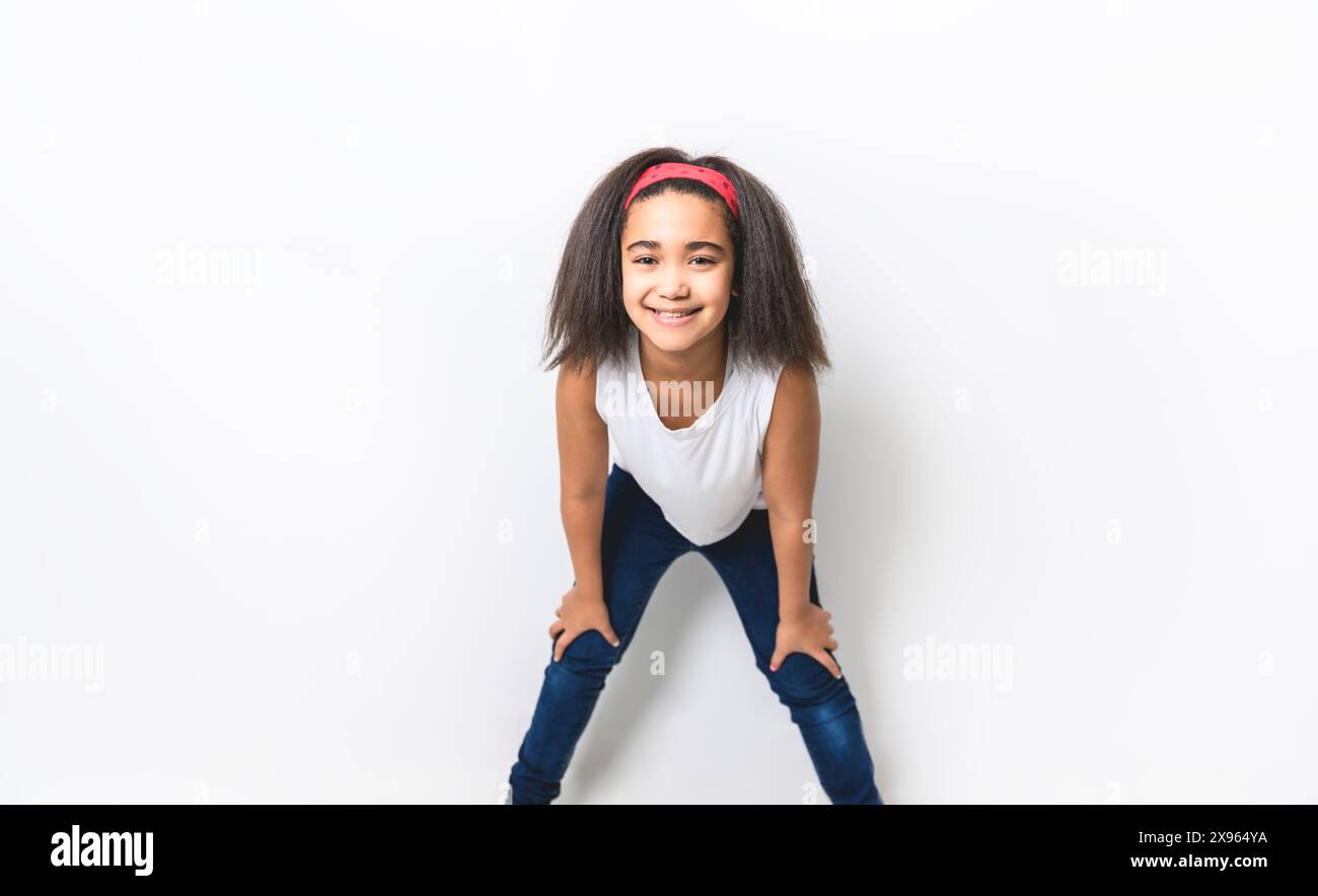 Adorable 9 years child girl on studio white background Stock Photo - Alamy