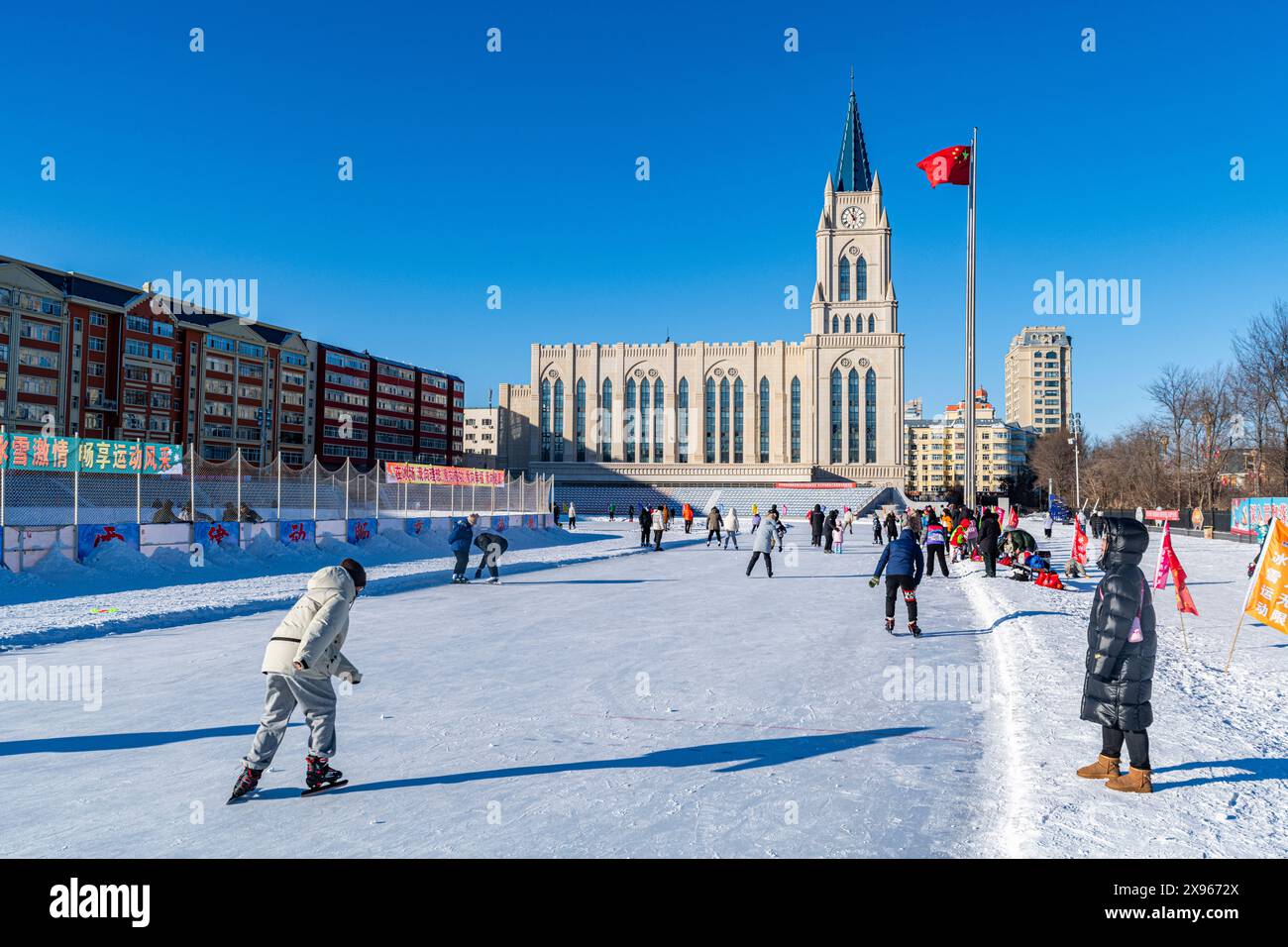 Skating rink in front of the old Cathedral, Heihe, Heilongjiang, China ...