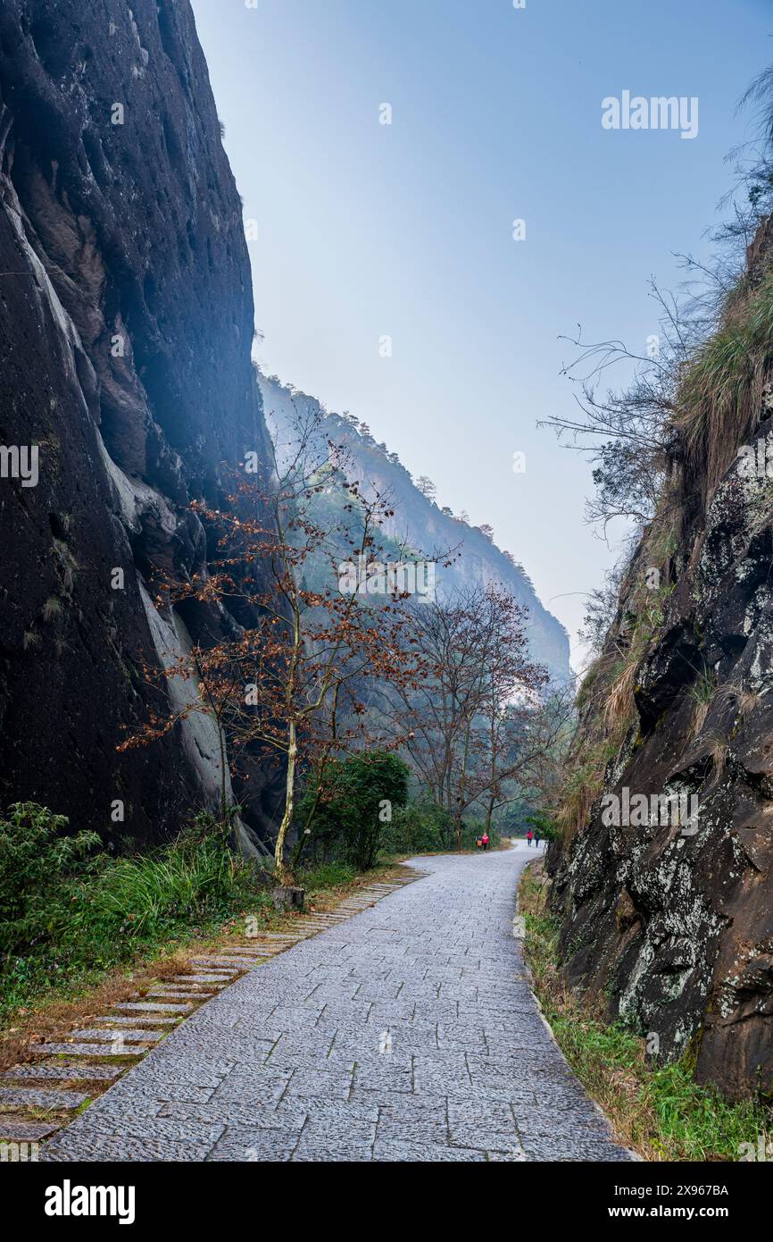 Road leading through huge granite rock walls, Mount Wuyi, UNESCO World ...