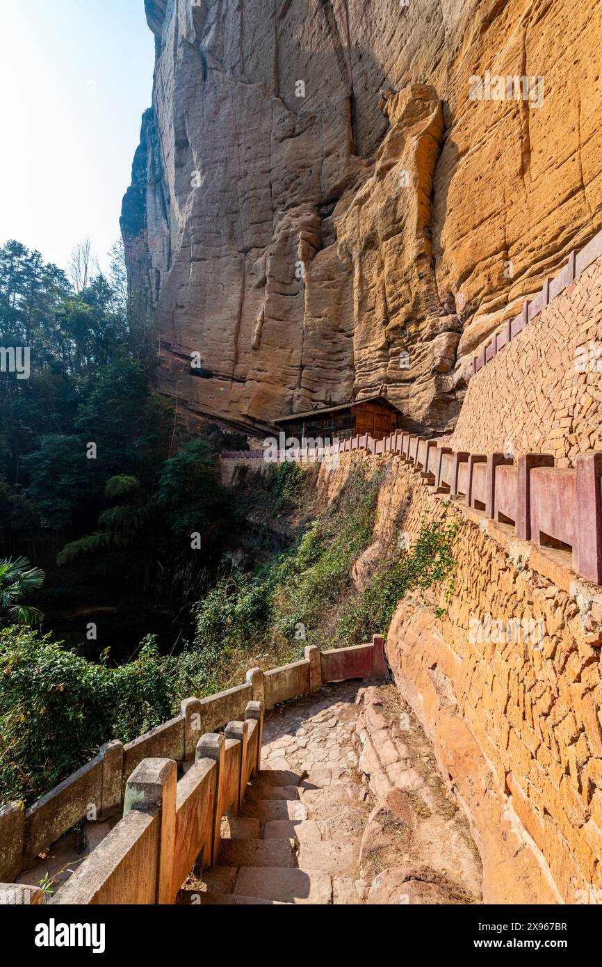 Temple in a giant rock wall, Wuyi Mountains, UNESCO World Heritage Site ...