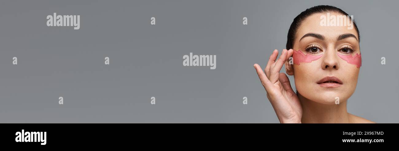 Attractive woman with pink eye patches enhancing her face Stock Photo ...