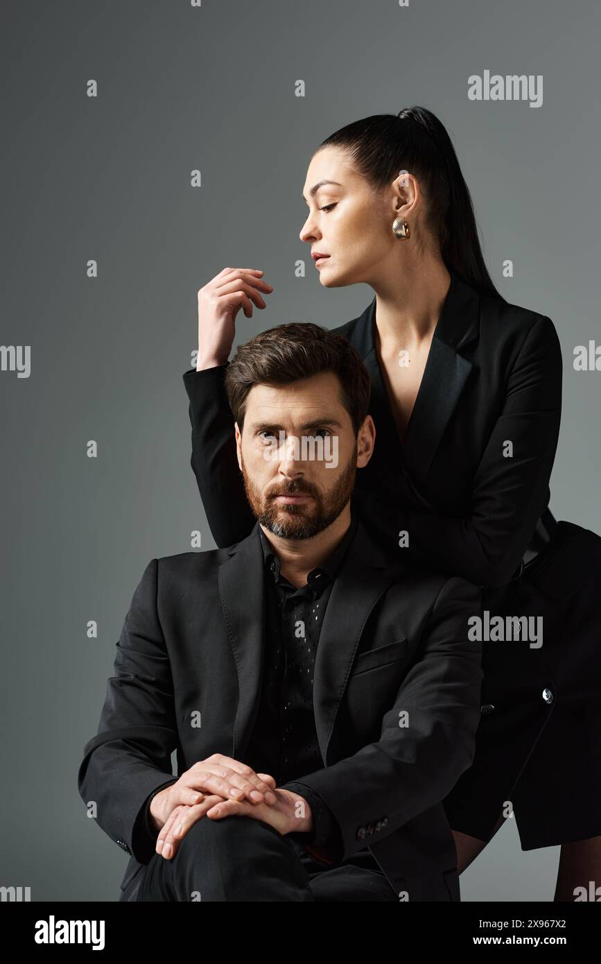 A loving couple in elegant attire pose side by side Stock Photo - Alamy