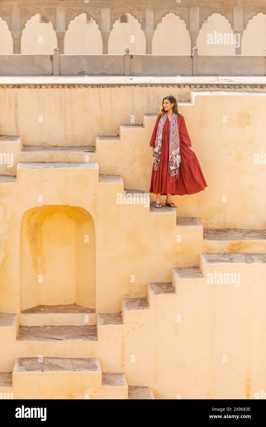 Woman in red garment at Panna Meena ka Kund, Jaipur, Rajasthan, India ...